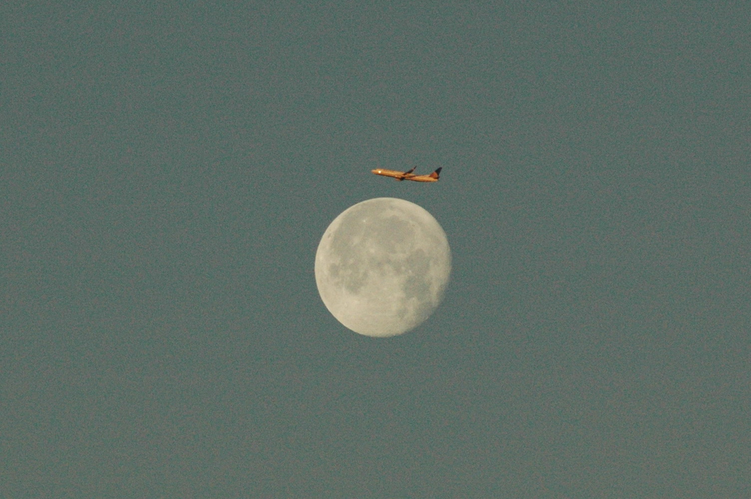 Moon over Pacific, Plane over Moon | MP Walsh - Sky & Telescope