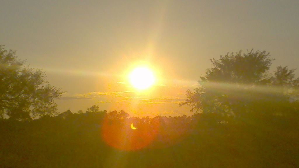 Eclipse at Sunset | Mark Chapman - Sky & Telescope
