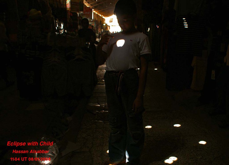 Eclipse and Child with Sunlight Beams | Hassan Alsabbar - Sky & Telescope