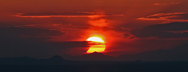 Rising eclipsed sun | Babak A. Tafreshi - Sky & Telescope